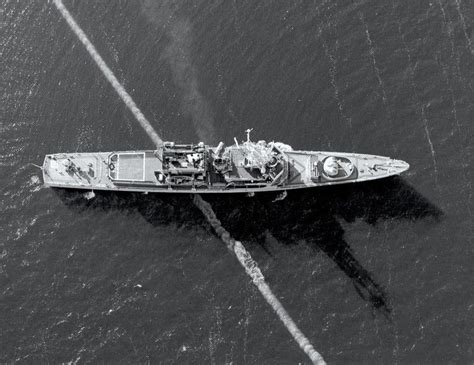 A Mk48 Torpedo Passing Under A Dealey Class Destroyer Escort Uss