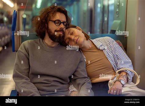 Young Tired Tourist Couple With Closed Eyes Is Travel Together While