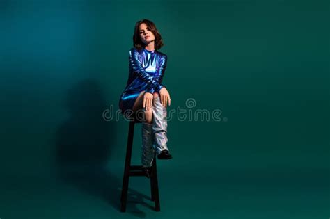 Full Size Photo Of Gorgeous Young Girl Sit Stool Empty Space Wear Shiny
