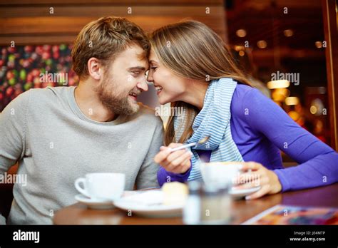 Portrait Of Young Man And His Girlfriend Having Date In Cafe Stock