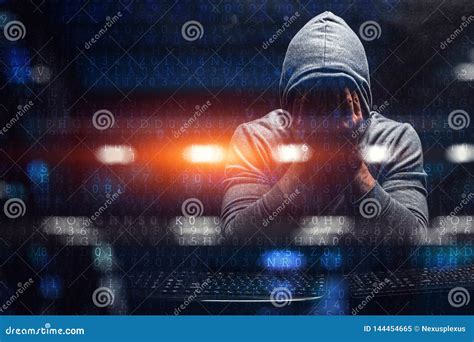 Hacker Hiding His Face Under Hood Trying To Cyber Attack Using Laptop Internet Crime Computer