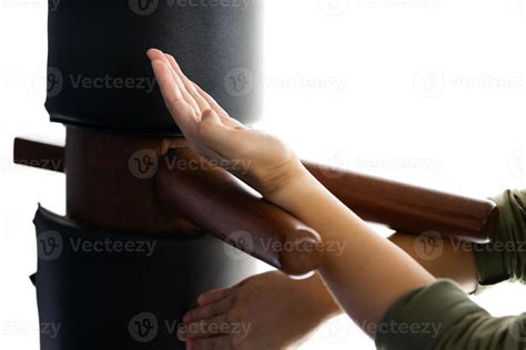 The Athlete Shows Techniques Wing Chun Kung Fu Wooden Dummy Wing Chun