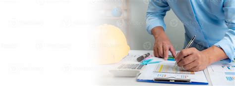 Architect Or Engineer Sitting At Desk In Office Cost Calculation Construction Planning