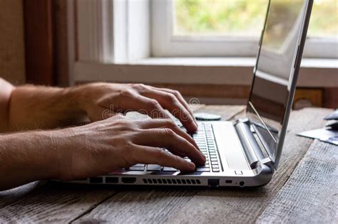 Hands Of A Man Working At A Computer Laptop By The Window Stock Image Image Of Male Home