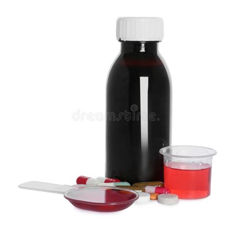 Spoon Measuring Cup And Bottle Of Cough Syrup Isolated On White Stock Photo Image Of