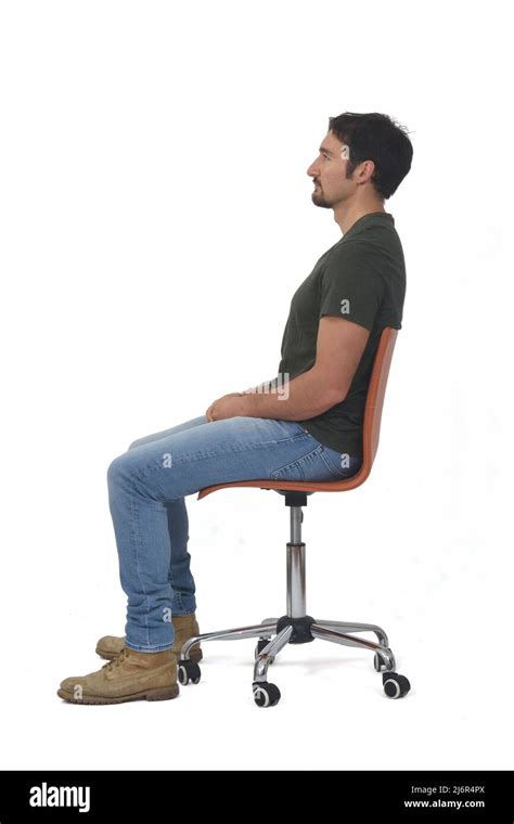 side view of a full portrait of man sitting on chair on whige background Stock Photo - Alamy