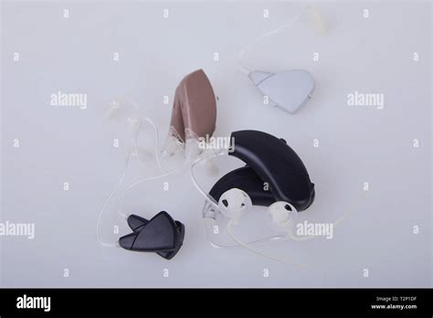 Small Modern Hearing Aids On White Background Isolated Alternative To