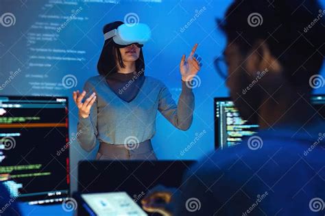 Asian And Indian Developer Devops Team Testing Virtual Reality Coding