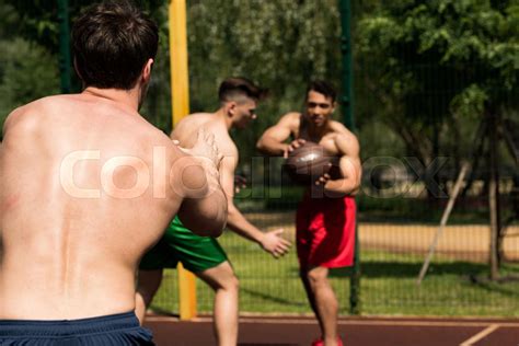 Shirtless Sportsmen Playing Basketball At Basketball Court In Sunny Day Stock Image Colourbox