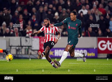 Brentfords Bryan Mbeumo Shoots Under Pressure From Liverpools Virgil Van Dijk During The