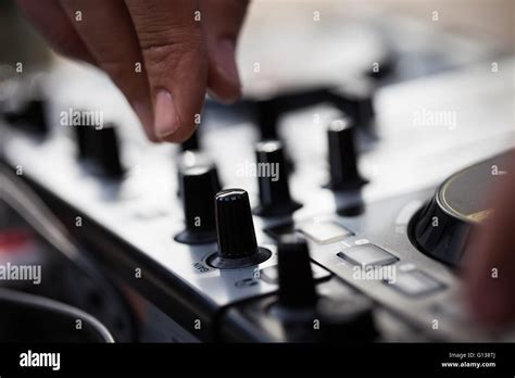 Hands Of Male Dj Playing Music On Modern Midi Controller Turntable Digital Device For Mixing