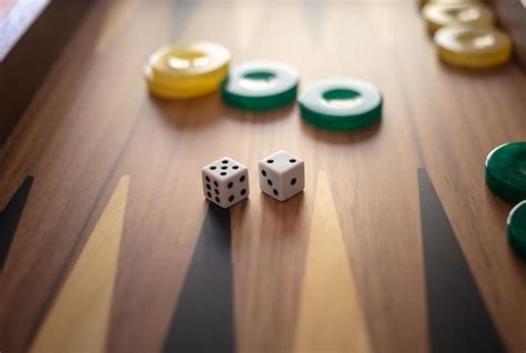 Premium Photo Backgammon Dice And Chips Closeup On Game Board