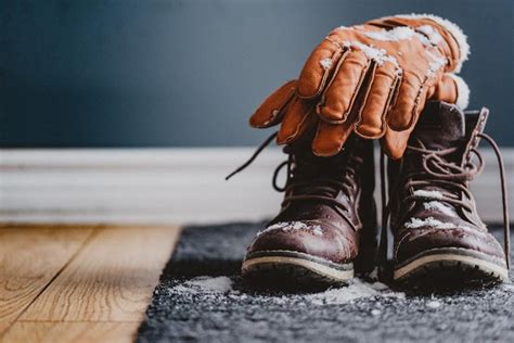 Premium Photo Low Section Of Shoes On Table
