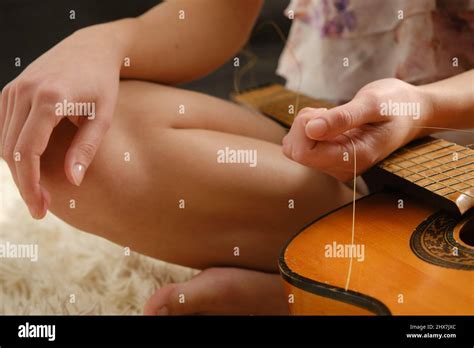 Broken Guitar Strings With Female Hands Guitar Repair Stock Photo Alamy