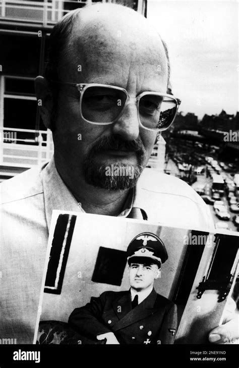 Niklas Frank Holds Up A Photograph In 1991 In Hamburg Germany Of His