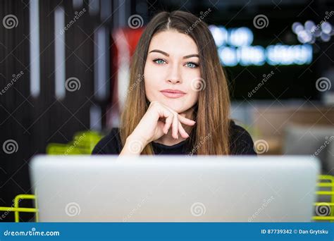 Entrepreneur Woman Working With A Laptop In A Coffee Shop Or Hub Smart