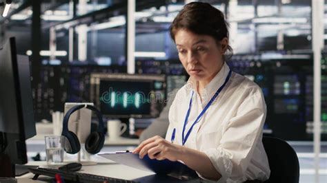 Server Room Admin Holding Clipboard Following Procedures Stock Footage