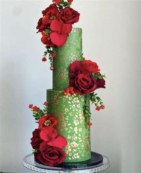 Elegant Three Tiered Green Cake With Red Flowers