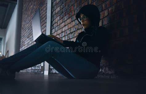 hacker woman in dark room with laptop and information technology