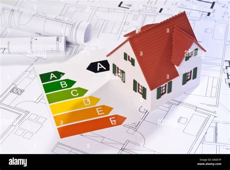 Energy Efficiency Label With Architectural Model And Blueprints Stock