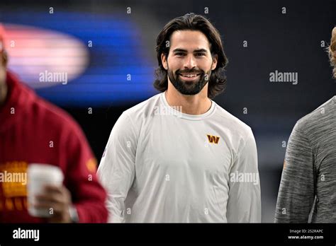Washington Commanders Quarterback Sam Hartman Walks On The Field Before