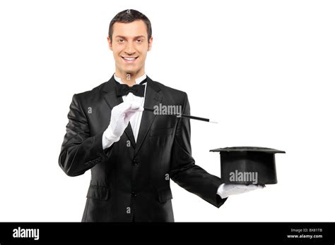 A Magician In A Black Suit Holding An Empty Top Hat And Magic Wand