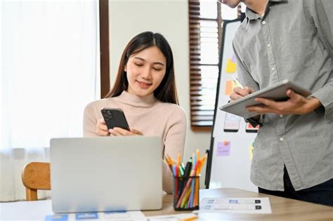 Premium Photo Professional Asian Female Developers Working With Her Colleague Ui Ux Business
