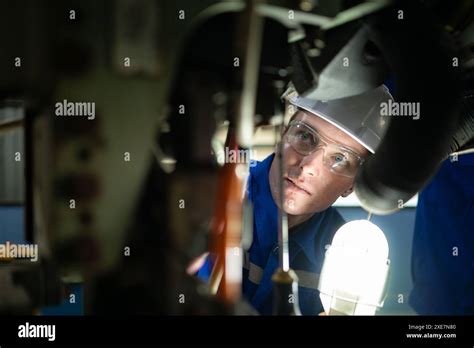 Engineers Working In A Robotic Arm Factory Robotic Arm Industry And Engineering Concept Stock