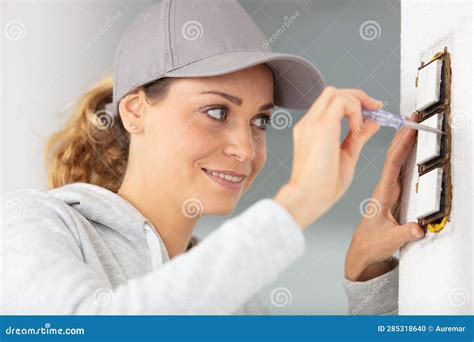 Woman Repairs Electric Socket With Screwdriver Stock Photo Image Of Wall Electrician