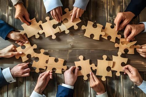 Employees Assembling Jigsaw Puzzle In Team Building Activity Premium