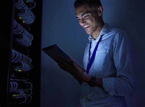Premium Photo Man Engineering And Tablet In Data Center Or Server