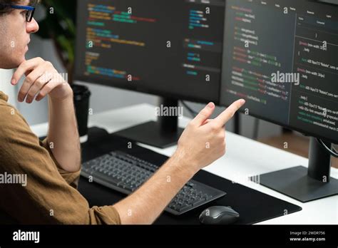 It Developer Working Online Software Development On Pc Monitors At Modern Home Office On Coding