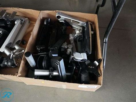2 Trays Of Monitor Stands Roller Auctions