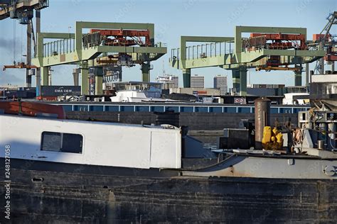 Cranes At Work Loading And Unloading Ships At The Port Of Rotterdam Stock Photo Adobe Stock