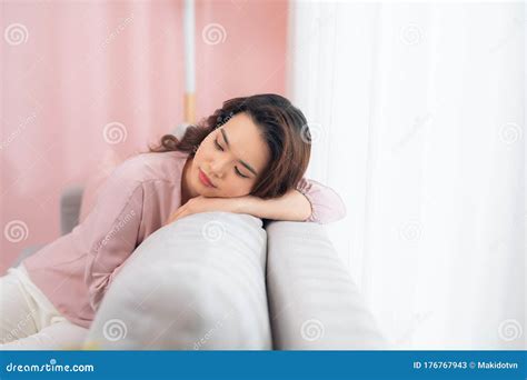 Thoughtful Girl Sitting On Couch At Home Stock Image Image Of