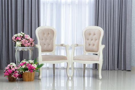 Simple And Elegant Living Room With A Touch Of Classical Theme Stock