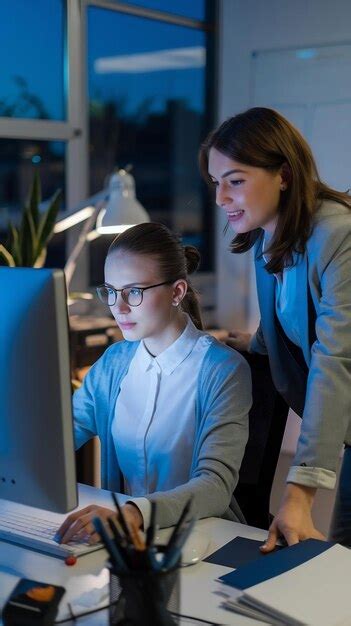 Software Developer Working On Desktop Computer In The Evening In Office Premium Ai Generated Image