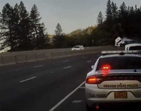 Oregon State Police Dash Cam Shows Truck Hauling Paper Rolls Toppling