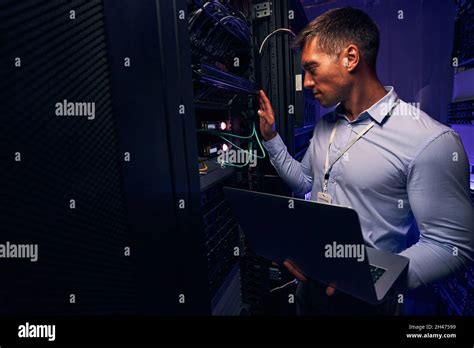 experienced data center system administrator running equipment