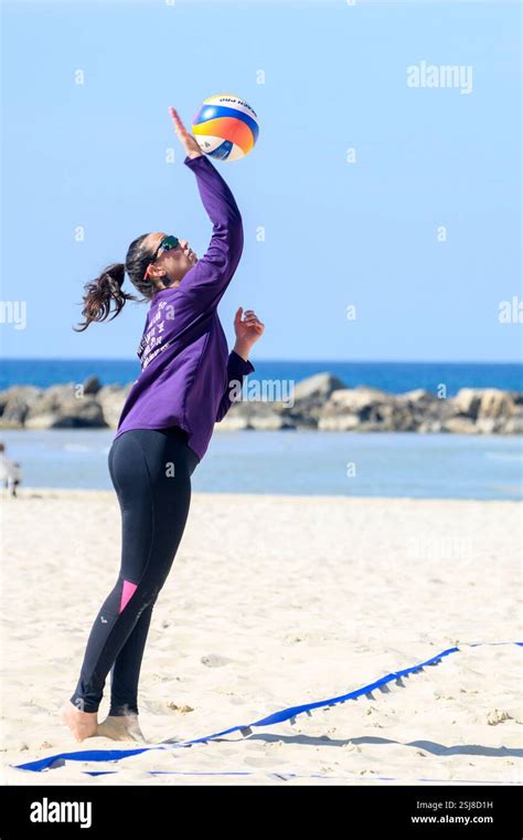 Four Young Women Are Playing Beach Volleyball On Gordon Beach Tel Aviv