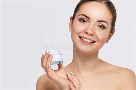 Beauty Woman Concept Skin Care Portrait Of Female Model Holding And Applying Cosmetic
