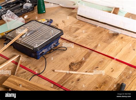 The Process Of House Renovation With Changing Of The Floor From Carpets To Solid Oak Wood