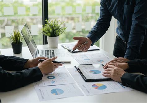 Business Meeting Data Analysis Laptop And Tablet Pie Charts Collaborative Workspace Office