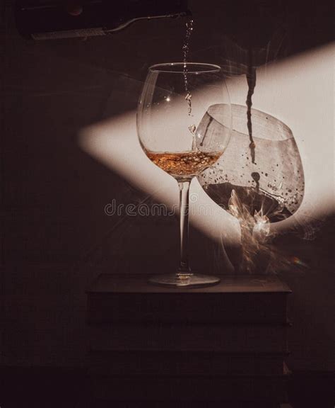 A Glass Of Wine On A Stack Of Books Stock Image Image Of Light Books