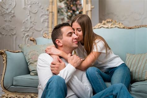 Free Photo Embraced Couple Kissing On Sofa