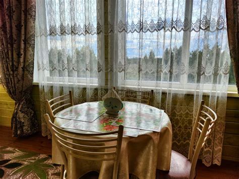 A Table In A Small Cozy Cafe Or Restaurant With A Window And Curtains Dimmed Lights Beautiful