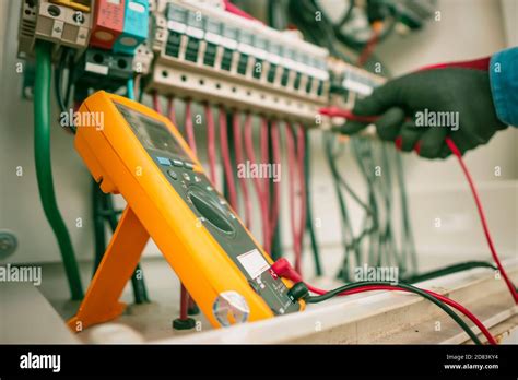Engineering Used A Multimeter To Measure The Voltage Of Electrical Wires Produced From Solar