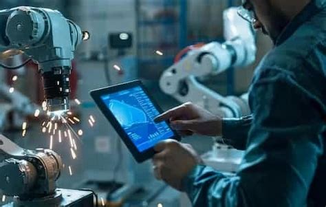 Engineer Operating Industrial Robotic Arm With Tablet In Hightech