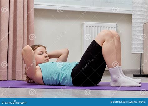 Cute Beautiful Girl Performs Abs Exercises At Home Stock Image Image