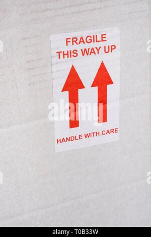 FRAGILE LABEL ON CARDBOARD BOX WITH THIS WAY UP SIGN Stock Photo Alamy